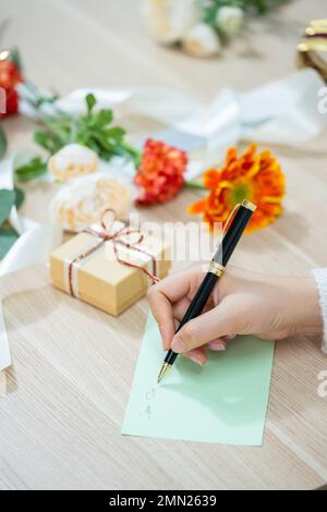 The young woman to write CARDS Stock Photo - Alamy