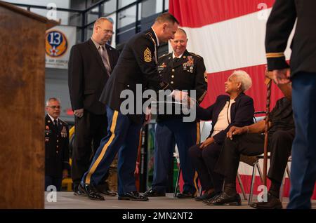 Command Sgt. Maj. Tully Culp shakes hands with Spc. Tarik Seaberry's ...