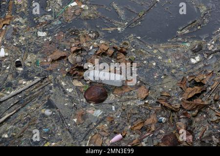 A giant floating rubbish heap floating in the river, plastic pollution ...