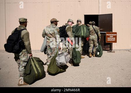 Airmen from the 319th Reconnaissance Wing carry deployment bags Sept ...