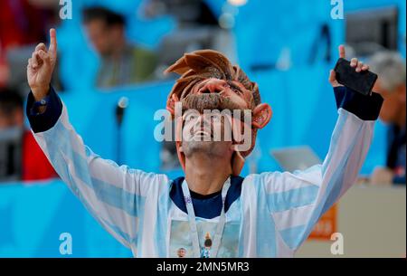 An Argentina wears a Lionel Messi mask prior to the FIFA World Cup ...
