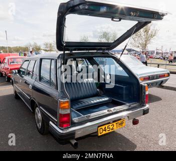 Three-quarters rear view of a Blue, 1967, Renault Alpine A110, on ...
