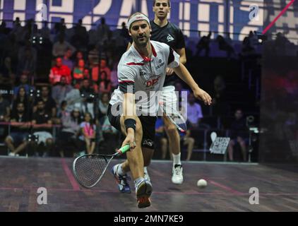 Ali Amr Farag of Egypt returns a shot from Karim Abdel Gawad of Egypt ...