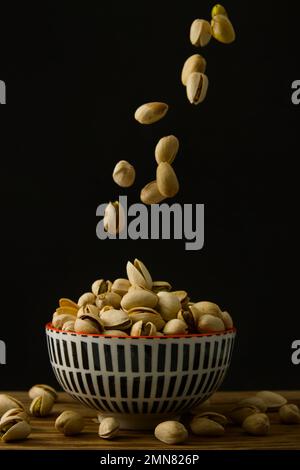 Pistachios falling on bunch isolated on white background Stock Photo ...