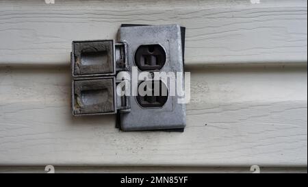 Electricity exterior wall plug socket Stock Photo - Alamy