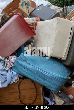 Personal effects from a house clearance casually thrown away in a ...
