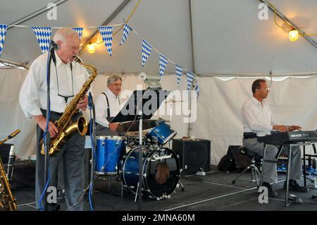 Stanley Basgall on saxophone, Mark Mazur on keyboard and John Westmacott on drums play at Fort ...