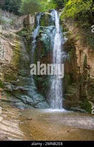 blue waterfall in Tbilisi green trees and bridge Stock Photo - Alamy