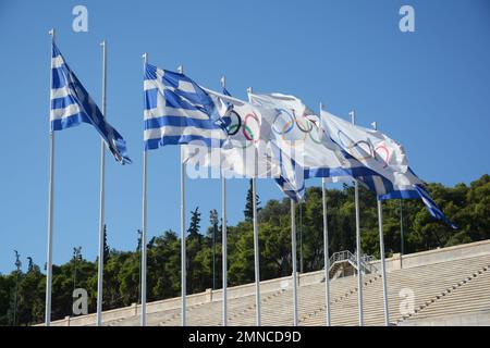 Flag of Greece Flying in Wind and Blue Sky Stock Photo - Alamy