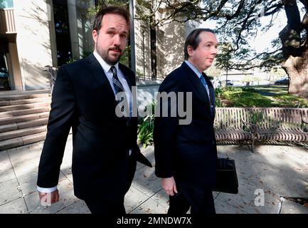 Jordan Hamlett, left, leaves federal court with his attorney Michael ...