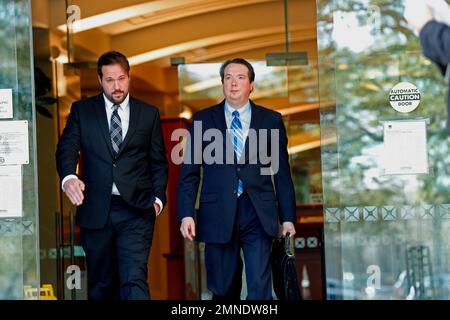 Jordan Hamlett, left, leaves federal court with his attorney Michael ...