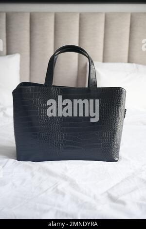 women purse wallet on bed, close up Stock Photo - Alamy