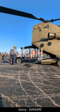 A civilian search and rescue vehicle loads on board a CH-47F Chinook ...