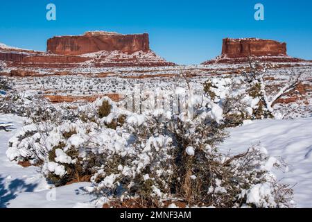 Merrimac and Monitor Butte stand guard just outside of Canyonlands ...