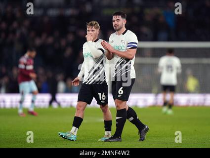Derby County's Liam Thompson (left) and Norwich City's Lewis Dobbin ...