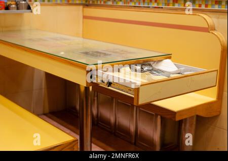 The interior of a traditional Cha chaan teng cafe, with booth seating ...