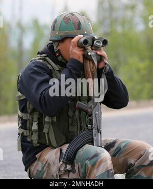An Indian Army Soldier looks through a 84 MM RL Gun at a Forward Post ...
