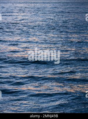 Sunlight reflected in ocean surface Stock Photo - Alamy