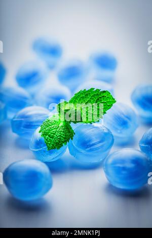 Blue menthol fresh balsamic syrup with mint leaves on a white ...