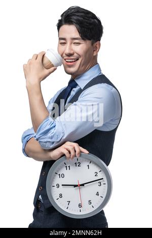 Business man took the clock and coffee Stock Photo - Alamy