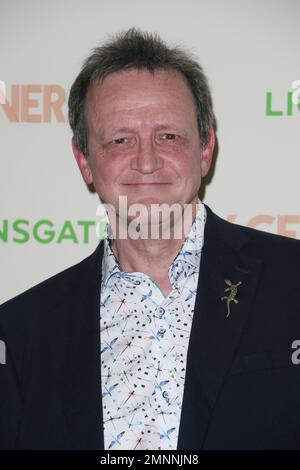 Director David Batty poses for photographers upon arrival at the ...