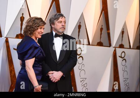 Marilou York, left, and Mark Hamill arrive at the Oscars on Sunday ...