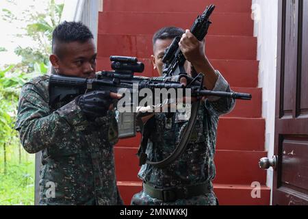 Philippine Marine Corps scout snipers and force reconnaissance Marines prepare a traditional ...