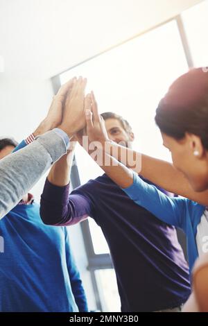 group of happy employees giving each other a high five Stock Photo - Alamy