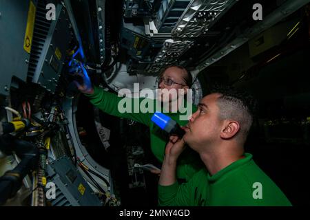 Aviation Electrician's Mate 1st Class Jesse Sabol (left), from ...
