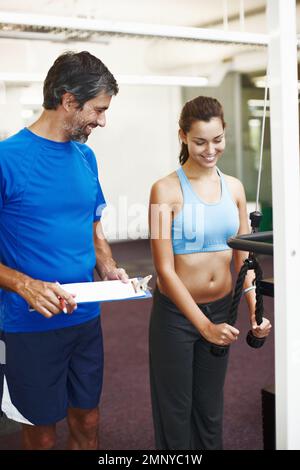 Fitness. Personal Trainer Takes Notes While Woman Exercising Outdoor ...