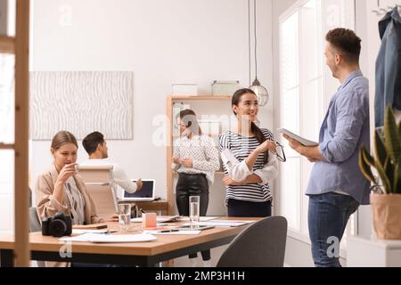 Team of professional journalists working in office Stock Photo - Alamy
