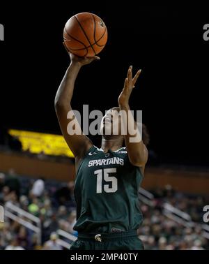 Michigan State forward Victoria Gaines (15) reaches for a rebound ...