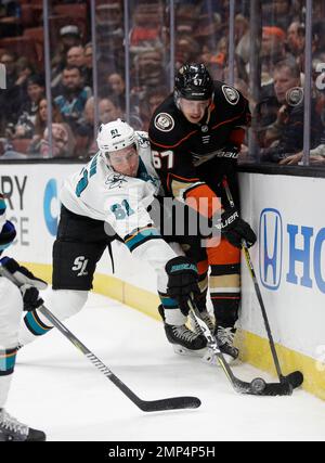Anaheim Ducks' Rickard Rakell, right, is defended by San Jose Sharks ...