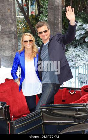 Colin Firth and Robin Wright Penn arrive in a horse-drawn carriage at ...
