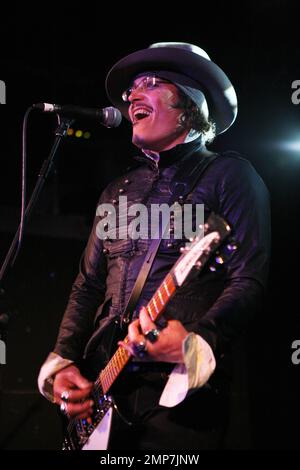 With his nails painted red and with a 'X' drawn on his cheek UK singer ...