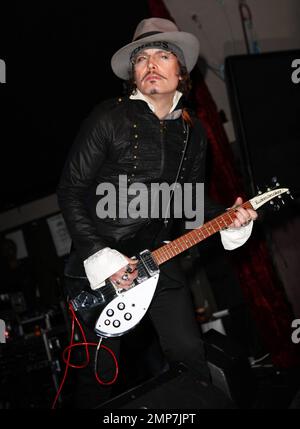 With his nails painted red and with a 'X' drawn on his cheek UK singer ...
