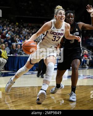 Central Florida's Zakiya Saunders, right, blocks a shot by Connecticut ...