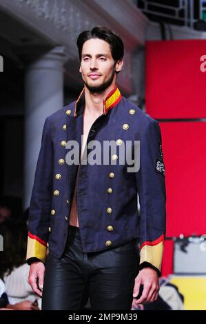 A model walks the runway during the Andrew GN Ready to wear FallWinter ...