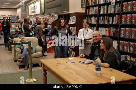 Danica Patrick, right, poses by her new race car with Tony Stewart, Sam ...