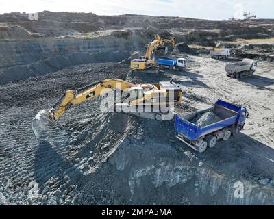 Excavators working together on huge mining site, Caterpillar excavators ...
