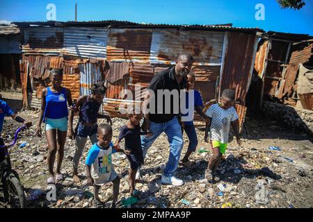 Jimmy Cherizier, the leader of the "G9 et Famille" gang, talks with ...