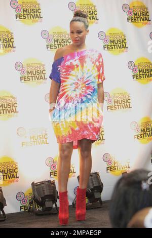 C Hip-hop artist Eve poses on the red carpet during the 2012 Essence ...