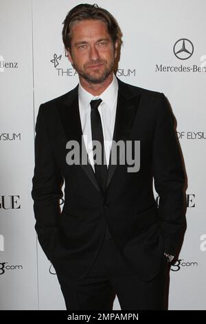 Showing off slicked back hair and a bit of a goatee a tanned and ...