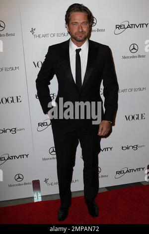 Showing off slicked back hair and a bit of a goatee a tanned and ...