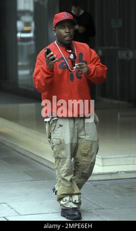 Outkast rapper Big Boi poses for photos outside his hotel during a ...