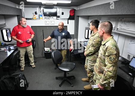 FEMA Deputy Administrator Erik Hooks listens to briefing provided by ...