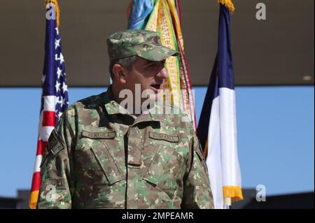 The Chief of the Romanian Land Forces Maj. Gen. Iulian Berdilă shakes ...