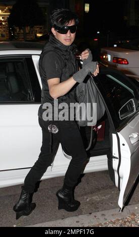 Fashion Designer Bobby Trendy strikes his usual poses in high heels as ...