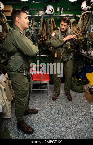 Rear Adm. Greg Huffman, right, commander, Carrier Strike Group (CSG) 12 ...