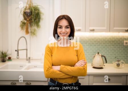 Photo of cheerful pretty lady arms hold showing small house isolated on ...